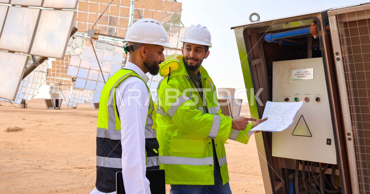 Two Saudi Arabian Gulf engineers supervising solar power plants ...