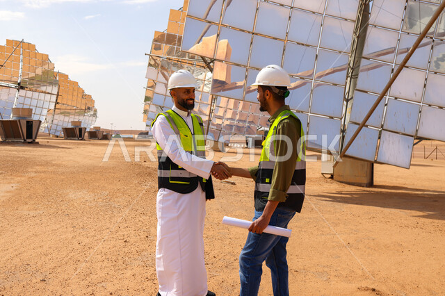 Two Saudi Arabian Gulf engineers supervising solar power plants ...