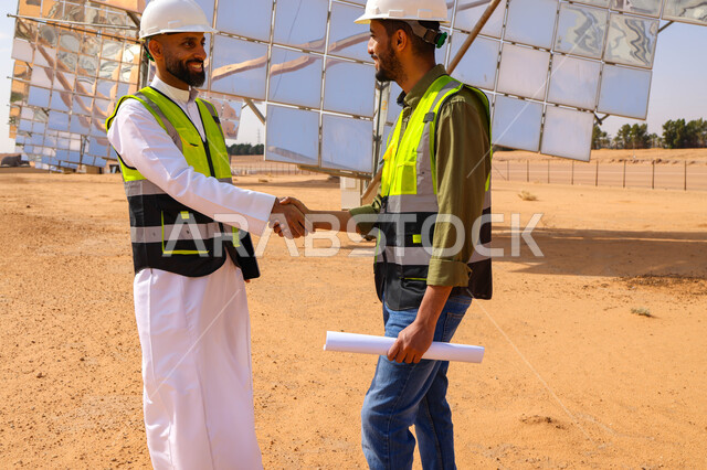 Two Saudi Arabian Gulf engineers supervising solar power plants ...