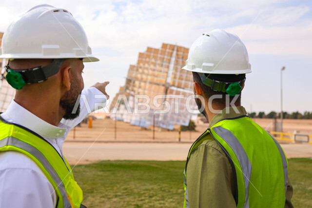 Two Saudi Arabian Gulf engineers supervising solar power plants ...