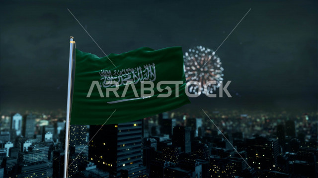 The Saudi national flag flutters high in the sky at night with ...