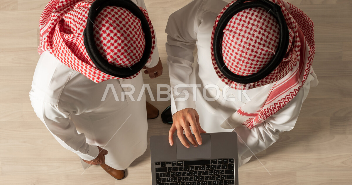 Joint group work, Saudi professions and jobs, a vertical overhead image ...