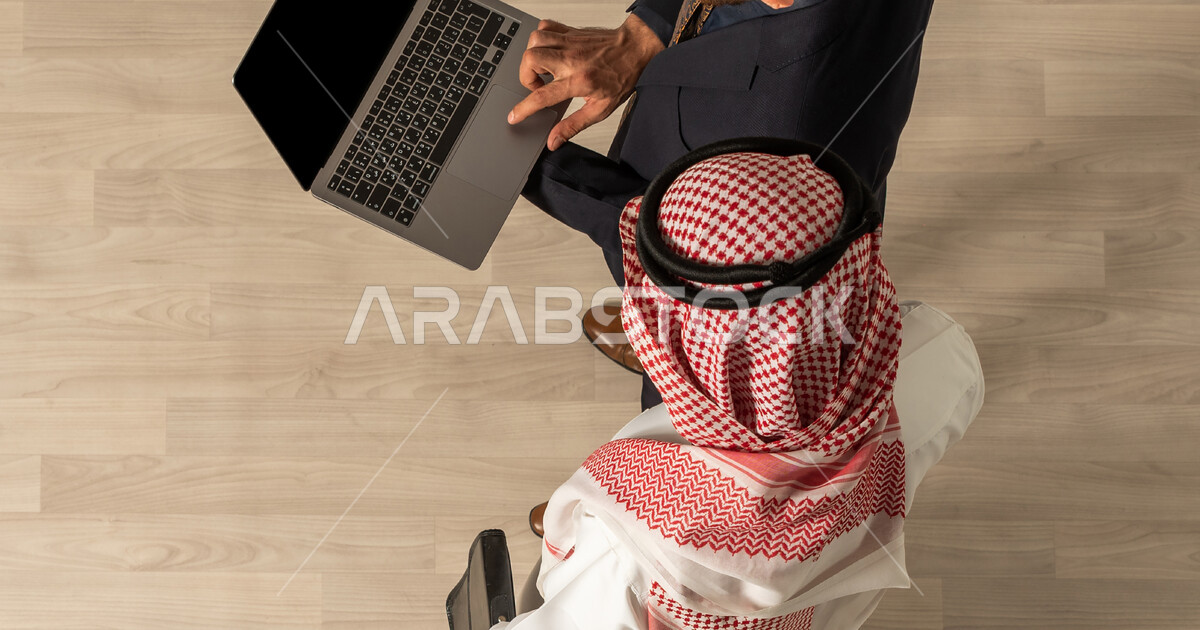 Completion of work tasks, vertical overhead image of a Saudi Arabian ...
