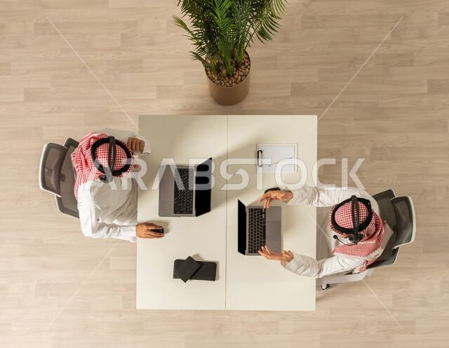 Office work, vertical overhead image of co-workers at the company's ...
