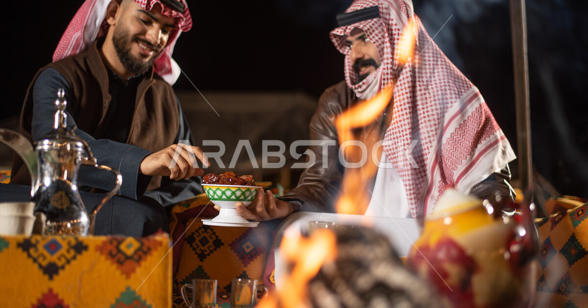 Copper Arabic coffee dallah, offering dates to guests, the concept of ...