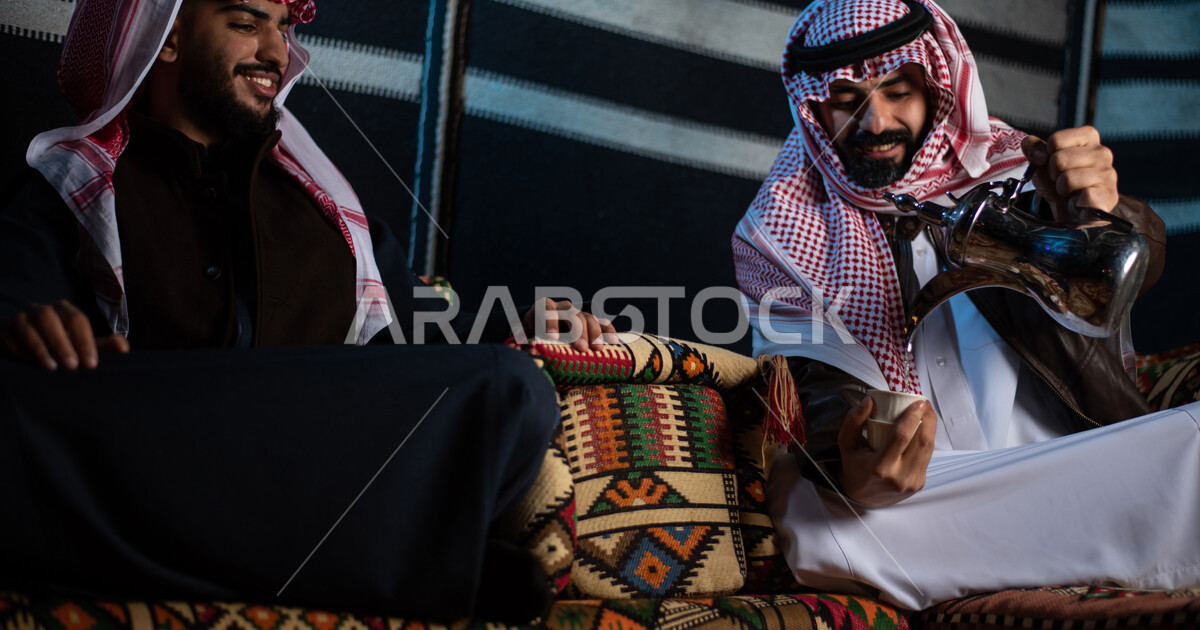 Popular tents in the deserts of Saudi Arabia, pouring coffee from a ...
