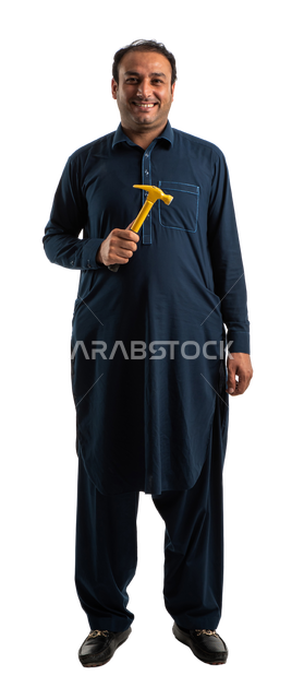 Portrait of a Pakistani construction worker holding a metal hammer and ...
