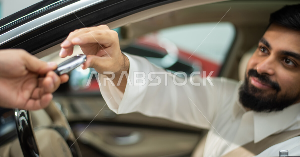 Car repair and maintenance services in the workshop, a smiling Saudi ...