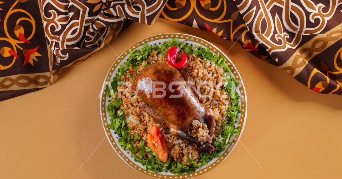 Popular rice dish with stuffed pigeons, Arabic food, oriental ...
