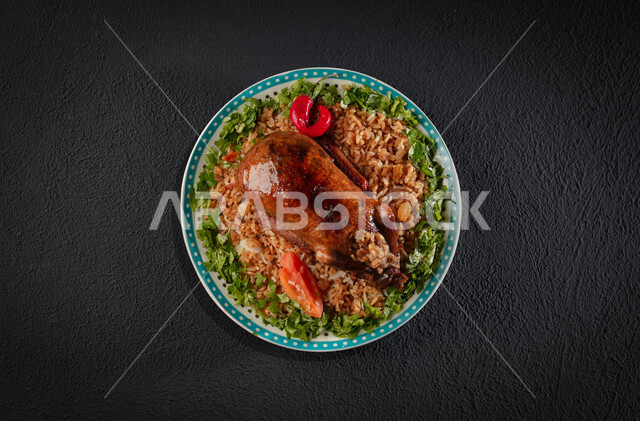 Popular rice dish with stuffed pigeons, Arabic food, oriental ...