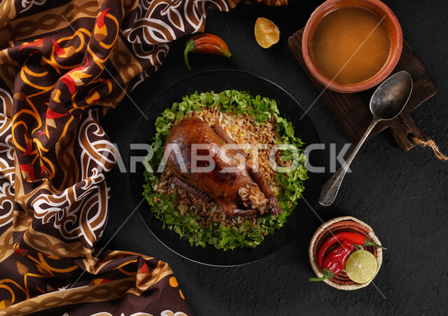 Popular rice dish with stuffed pigeons, Arabic food, oriental ...
