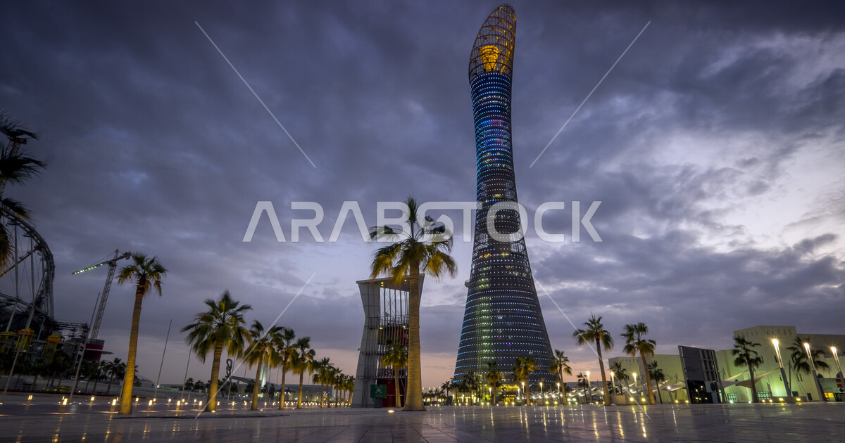The Torch Tower in the Sports City in Doha, Qatar, palm trees ...