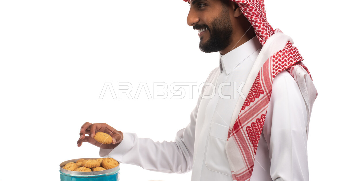 Biscuits stuffed with dates, a portrait of a Saudi Arab Gulf man ...