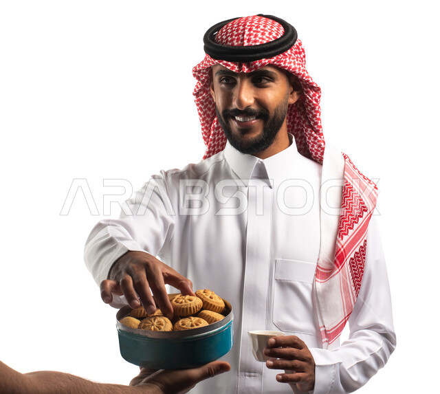 Biscuits stuffed with dates, a portrait of a Saudi Arab Gulf man ...