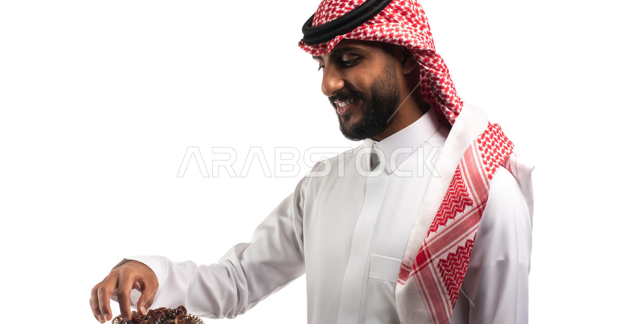 Hospitality in Ramadan, a portrait of a Saudi Arabian Gulf man wearing ...