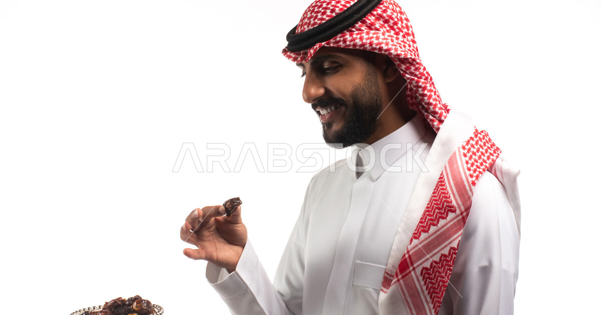 Hospitality in Ramadan, a portrait of a Saudi Arabian Gulf man wearing ...