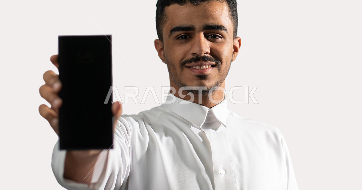 Displaying a blank black screen, a portrait of a young Saudi Arabian ...
