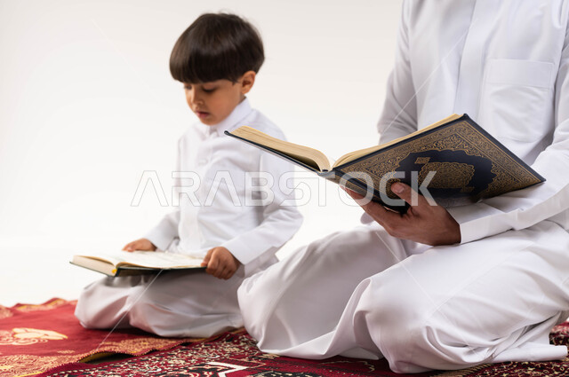 Close-up pictures of a Saudi Arabian Gulf boy, holding the Holy Qur’an ...