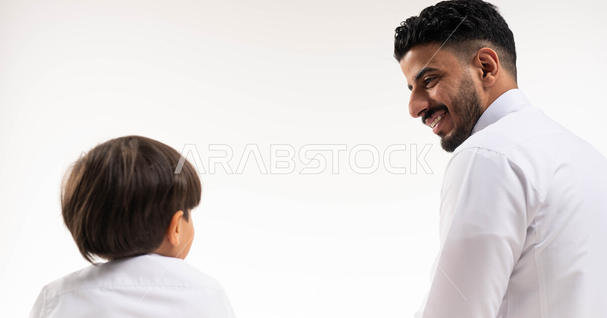 Portrait of a Saudi Arabian Gulf man with his son, dialogues and ...