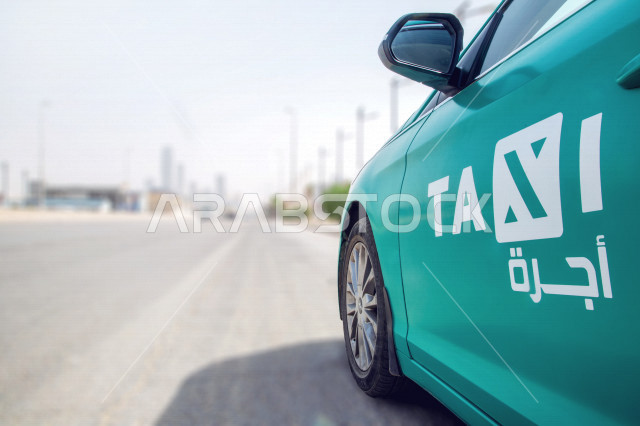 Green taxi in the streets of Saudi Arabia, taxi with modern tracking ...