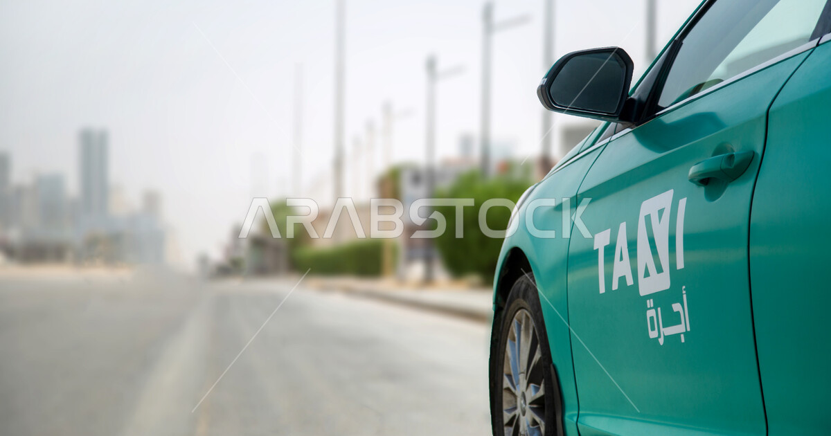 Green taxi in the streets of Saudi Arabia, taxi with modern tracking ...