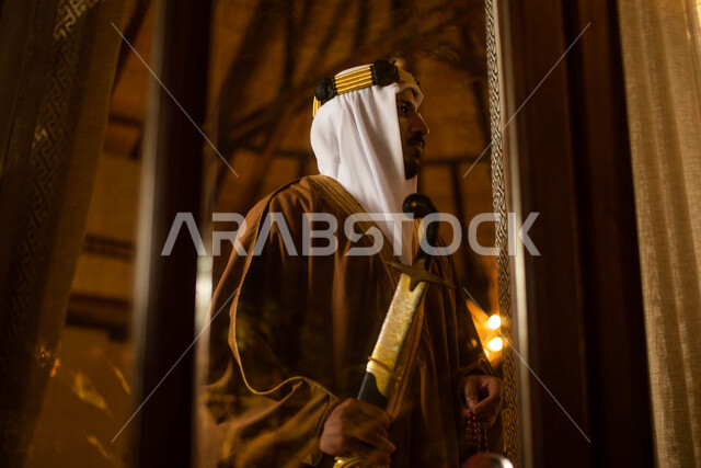 A Saudi Arabian Gulf man wears a Saudi traditional costume for national ...