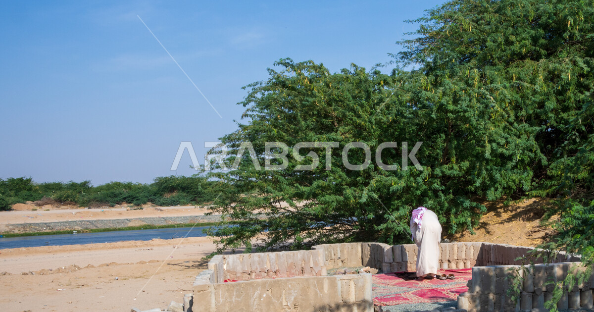 A Saudi Arabian Gulf man prays in an open-air mosque near the Jeddah ...