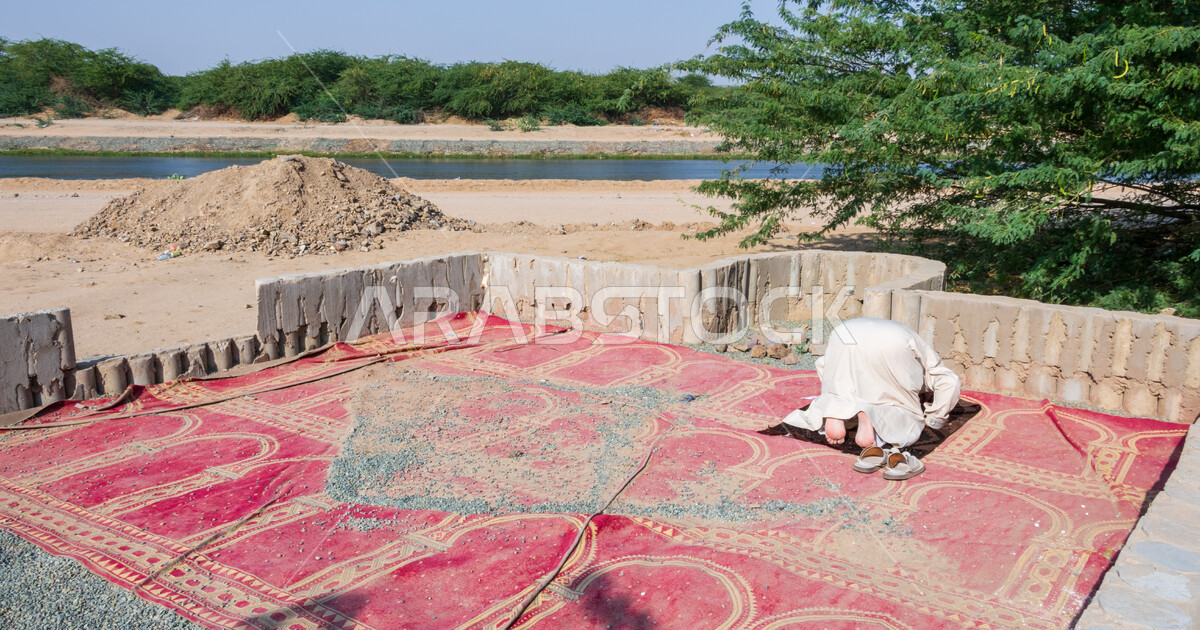 A Saudi Arabian Gulf man prays in an open-air mosque near the Jeddah ...