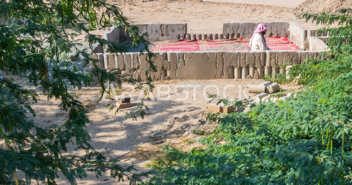 A Saudi Arabian Gulf man prays in an open-air mosque near the Jeddah ...