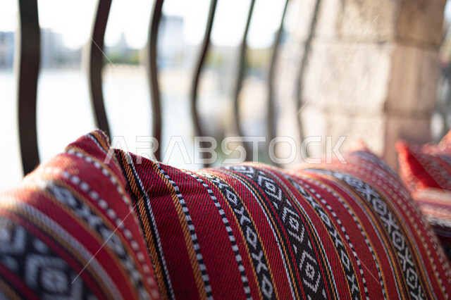 A close-up of Sadu embroidery on the cushions of the popular Arab ...