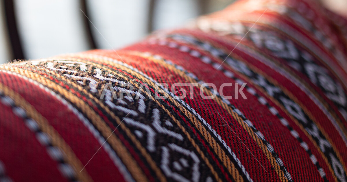 A close-up of Sadu embroidery on the cushions of the popular Arab ...