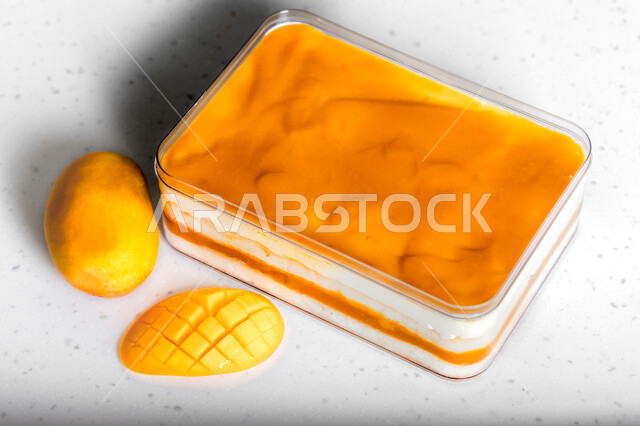 .Delicious mango cake, cake with layers of cream and fresh mango ...