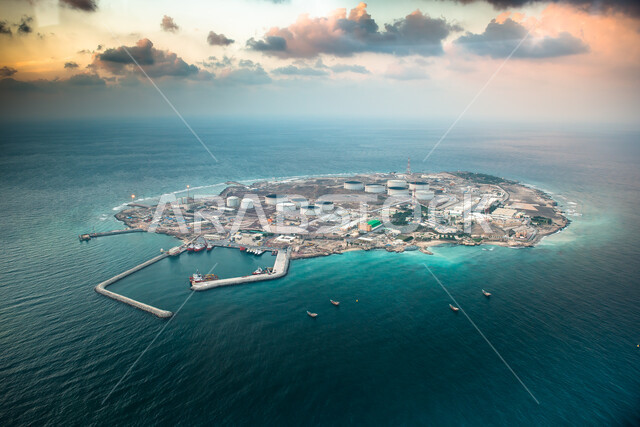 An overhead view of Halul Island in the State of Qatar, cloudy sky, oil ...
