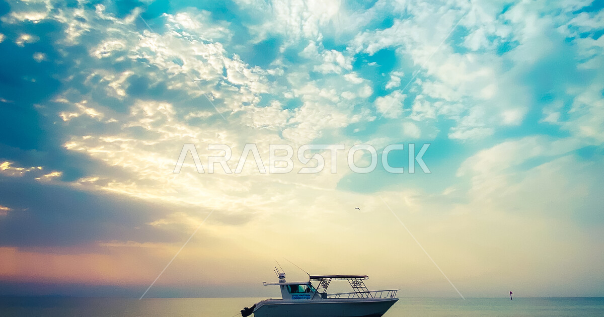 North Beach Corniche in Yanbu, the sea in Saudi Arabia at sunset, boat ...