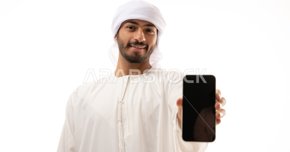Portrait of an Arab Emirati Gulf man wearing Emirati dress, smiling ...