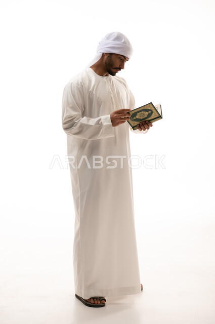 Portrait of an Arab Emirati Gulf man wearing Emirati dress holding the ...