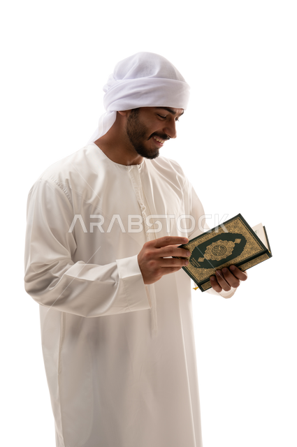 Portrait of an Arab Emirati Gulf man wearing Emirati dress holding the ...