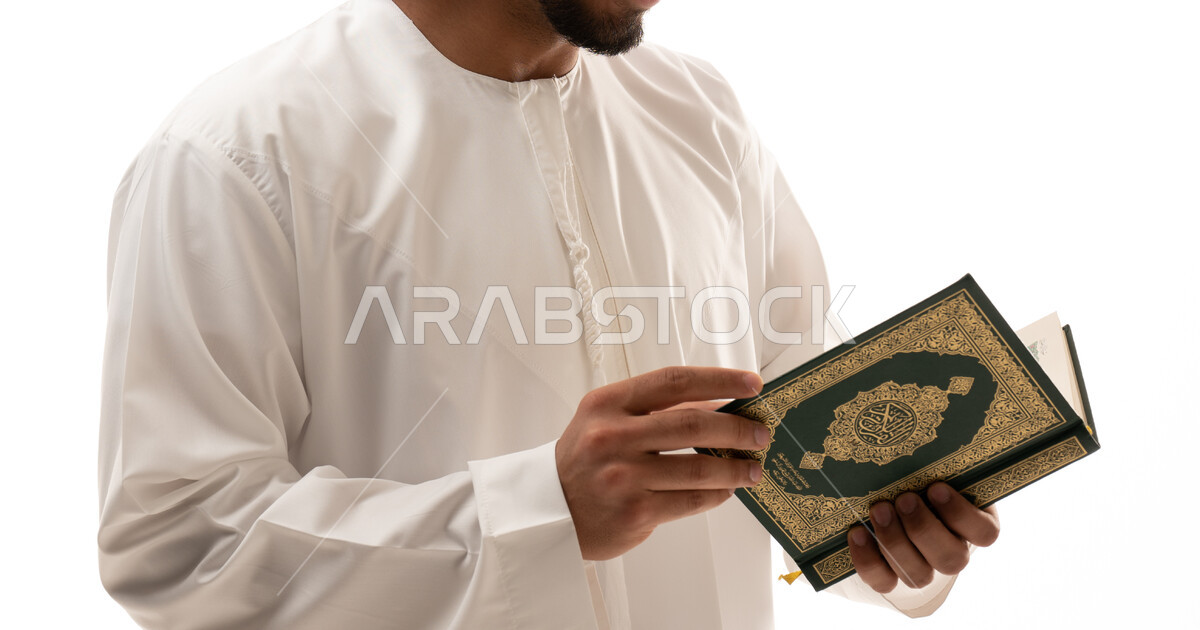 Portrait of an Arab Emirati Gulf man wearing Emirati dress holding the ...