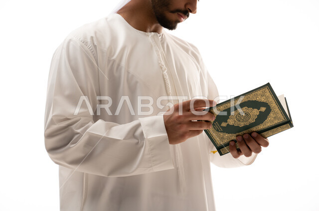 Portrait of an Arab Emirati Gulf man wearing Emirati dress holding the ...