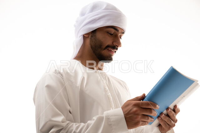 Portrait of an Arab Emirati Gulf man wearing Emirati dress holding a ...