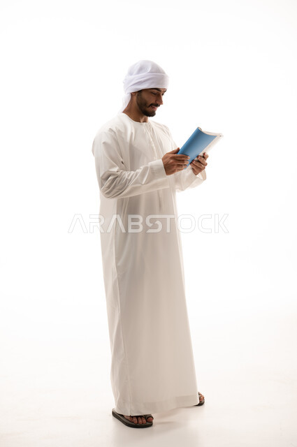 Portrait of an Arab Emirati Gulf man wearing Emirati dress holding a ...