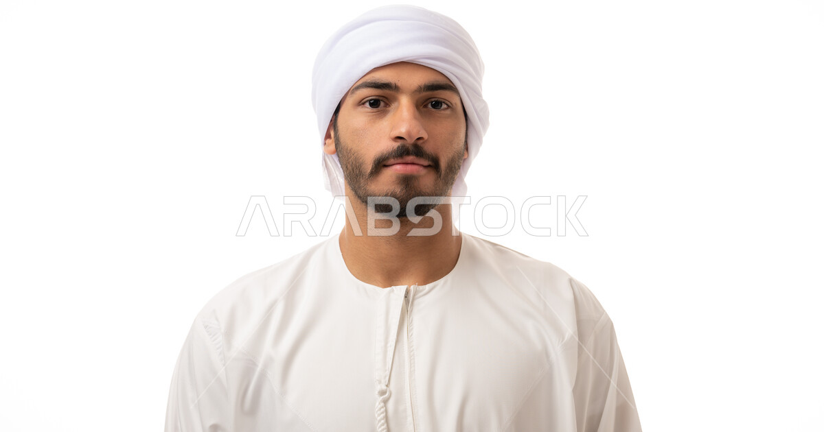Portrait of an Emirati Arab Gulf youth in traditional Emirati dress ...