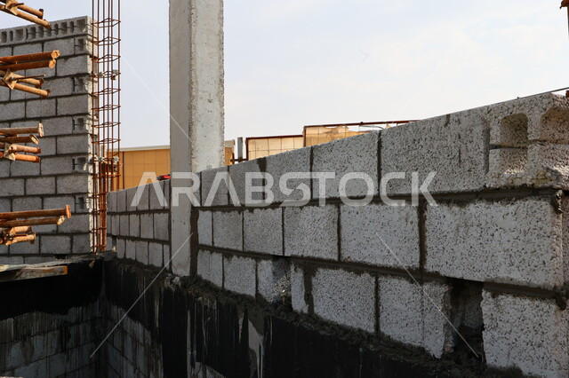 Construction work, stone wall, wall made of bricks and cement, brick ...