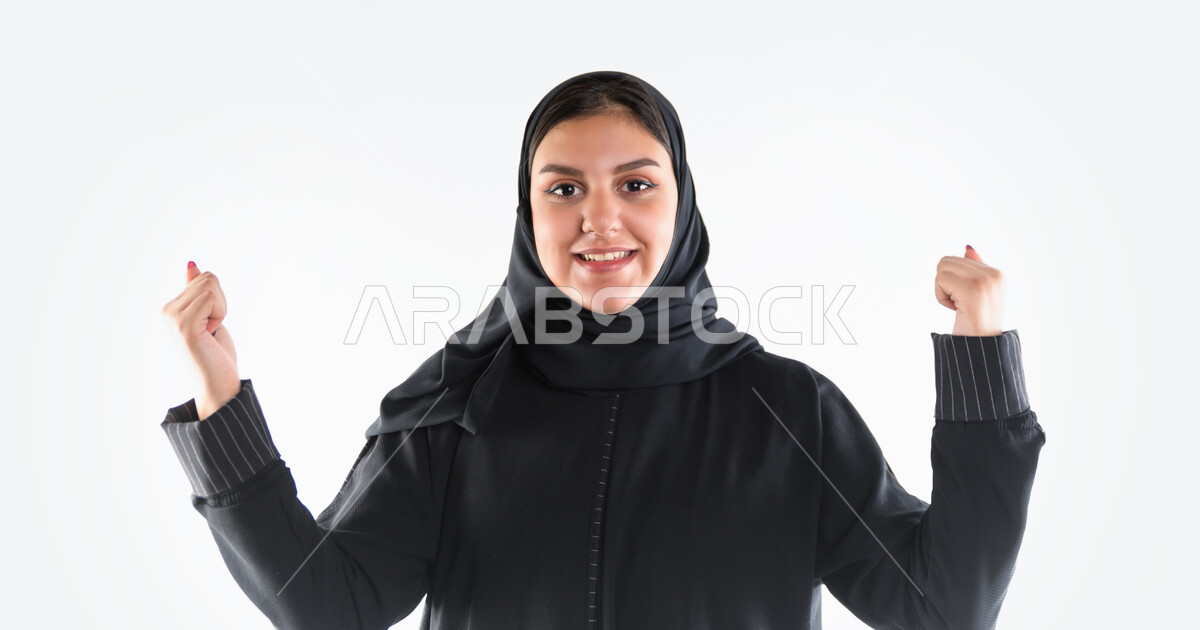 Portrait of a Saudi Arabian Gulf woman wearing an abaya and veil ...