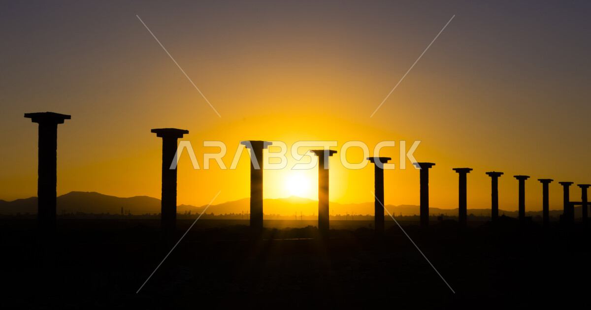 Silhouette of columns during sunset, orange color of sunset, nature ...