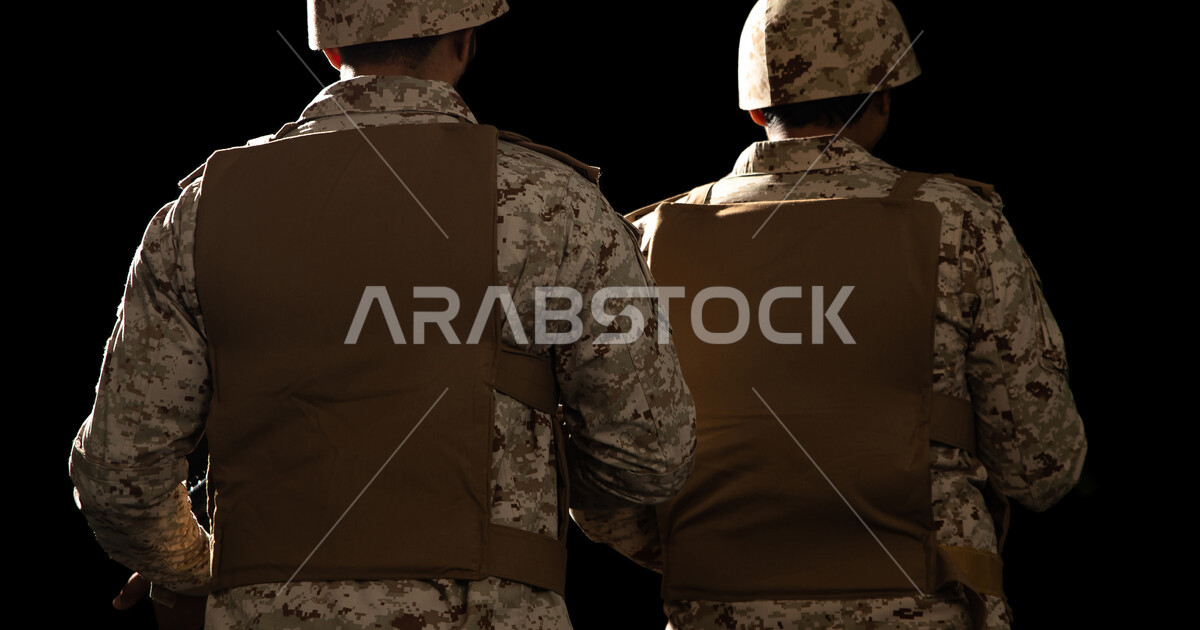 Portrait of two Saudi Arabian Gulf soldiers wearing traditional ...
