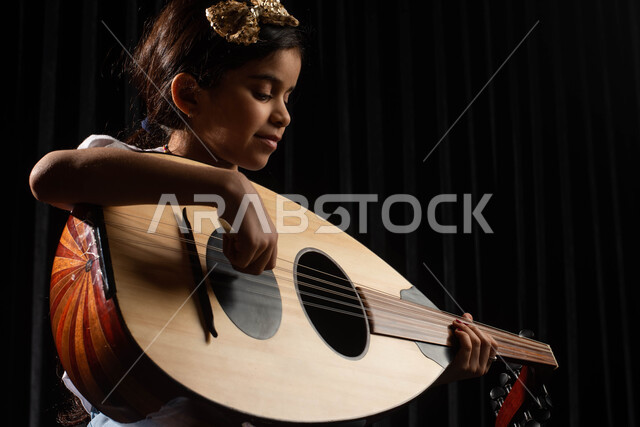 Practicing the hobby of playing using the oud instrument, musical ...