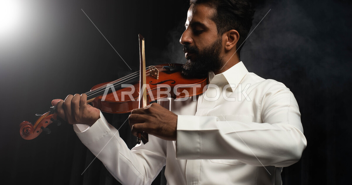 Playing the violin, musical artistic talents, a Saudi Arabian Gulf ...
