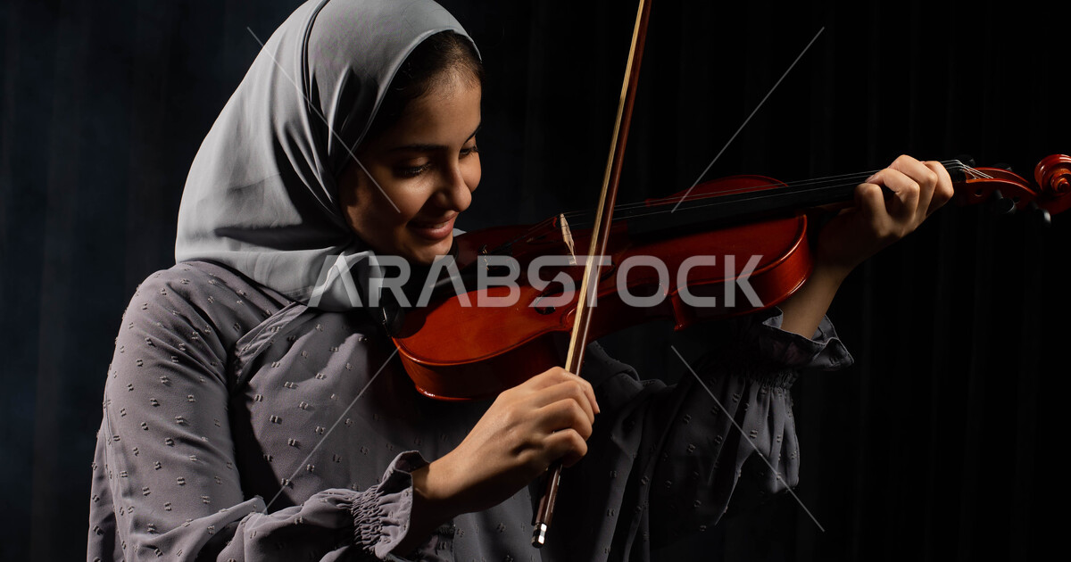 Practicing the hobby of playing using the stringed violin, presenting ...