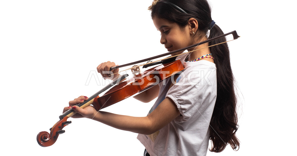Practicing the hobby of playing the violin, a portrait of a Saudi Gulf ...